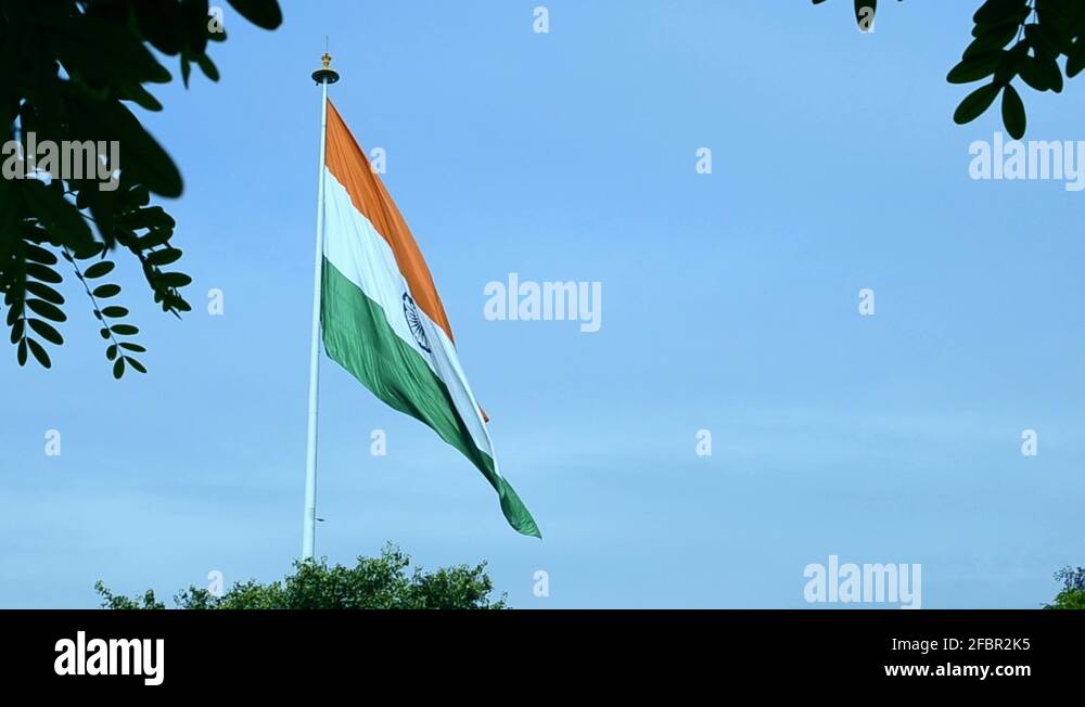 Big Waving Indian National Flag tricolour flying on blue sky outdoor ...