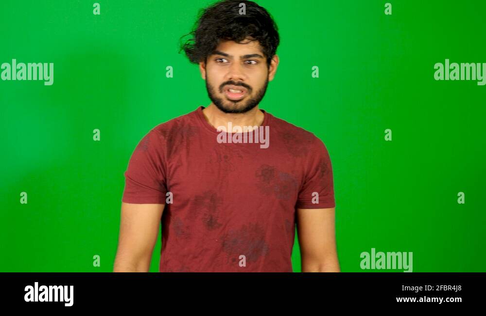 Indian man shy with green background Indian green screen Stock Video ...