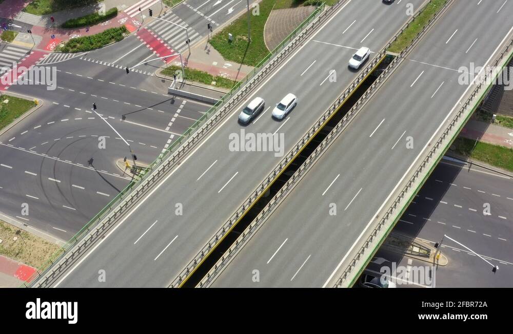 Highway aerial with cars and truck lorrying aerial view 4k. Four lane ...