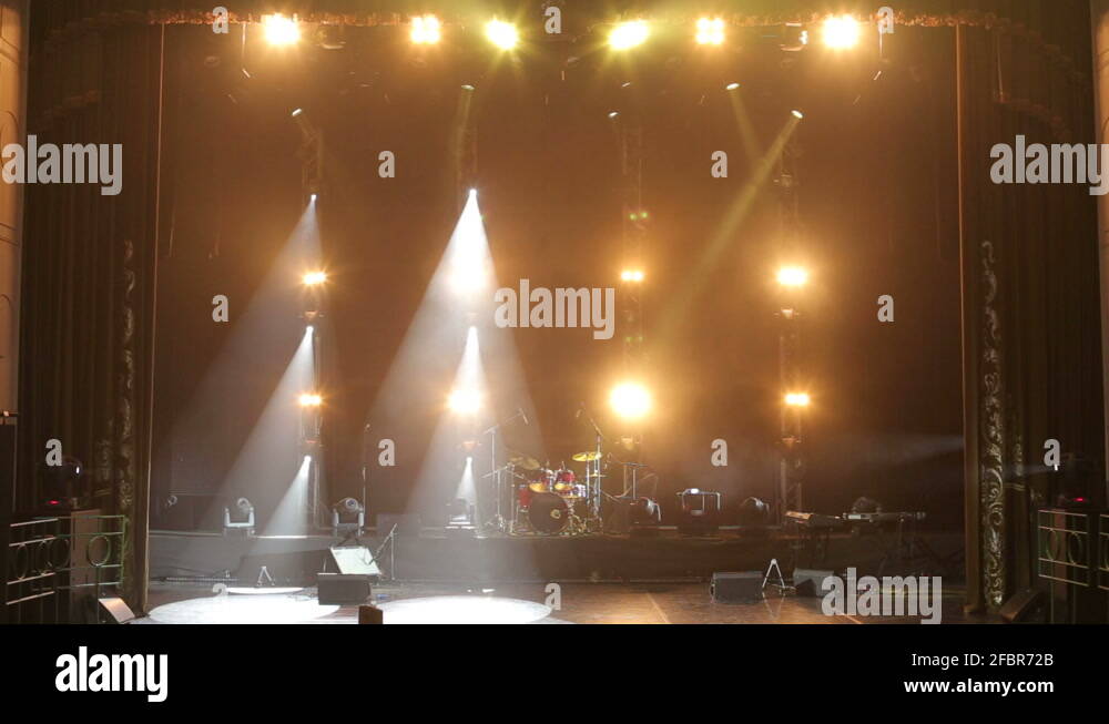 Stage lighting. Light show. Musical instruments and drum set on an ...