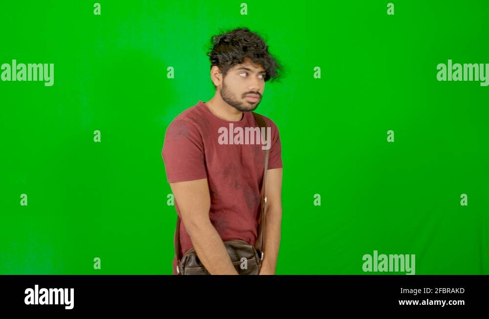 Indian man shy with green background Indian green screen Stock Video ...