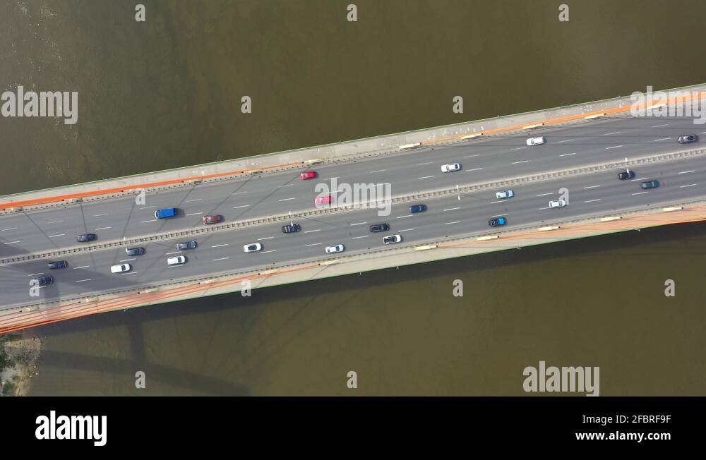 Car driving on highway bridge and road intersection in modern city ...