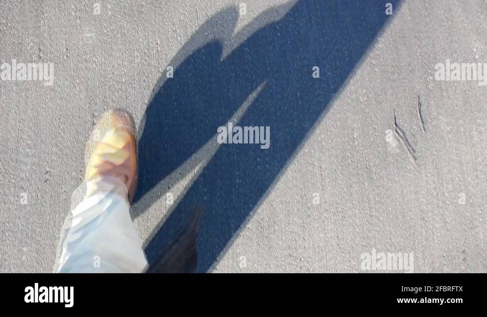 A man walking on asphalt Stock Videos & Footage - HD and 4K Video Clips ...