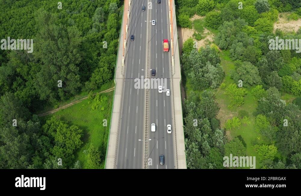 Car driving on highway bridge and road intersection in modern city ...