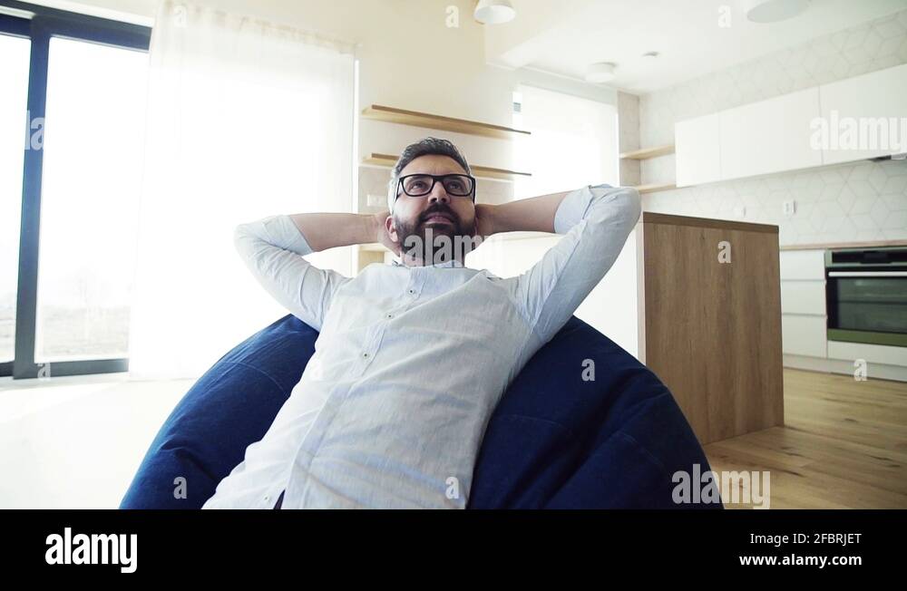 Man sitting inside house Stock Videos & Footage - HD and 4K Video Clips ...