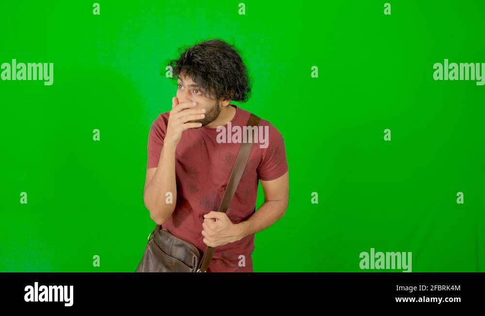 Indian guy express emotion with green background green screen Stock ...