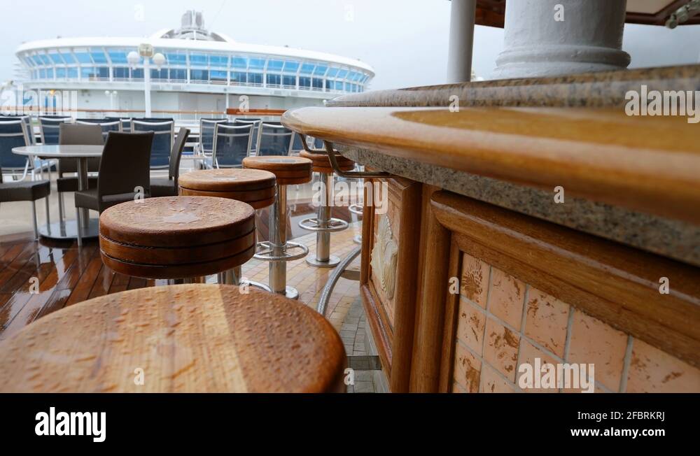 PANNING LEFT AND RIGHT Wet bar chairs, stools and tables of cruise ship ...