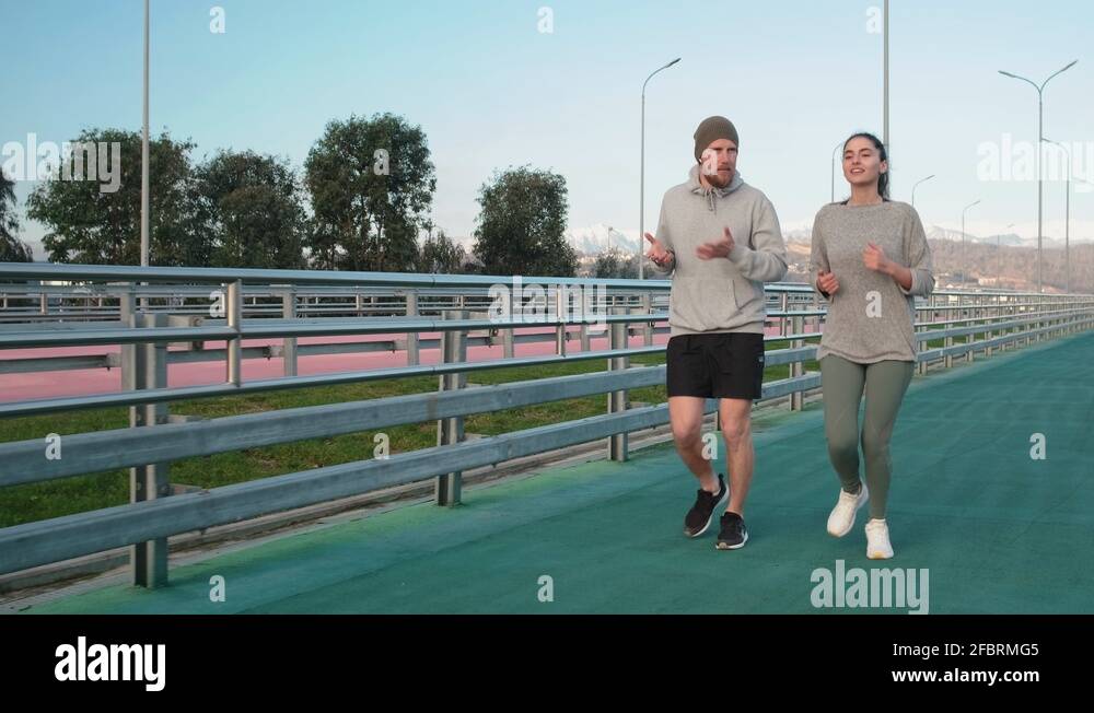 Guy and girl running Stock Videos & Footage - HD and 4K Video Clips - Alamy