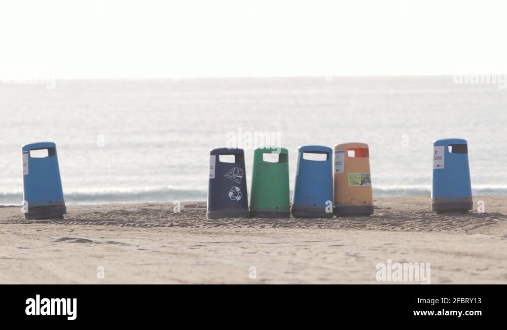 Recycling bins in a beach Stock Video Footage - Alamy