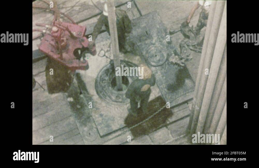 1960s: UNITED STATES: men drill exploratory well from offshore platform ...