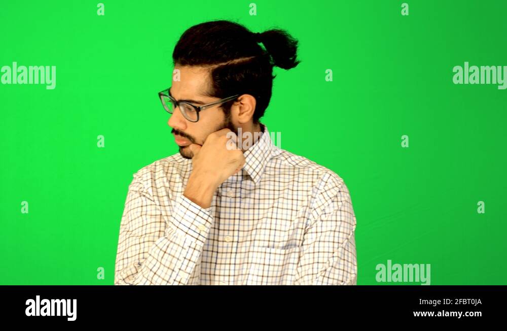 male business man looking left and right with green background / green ...
