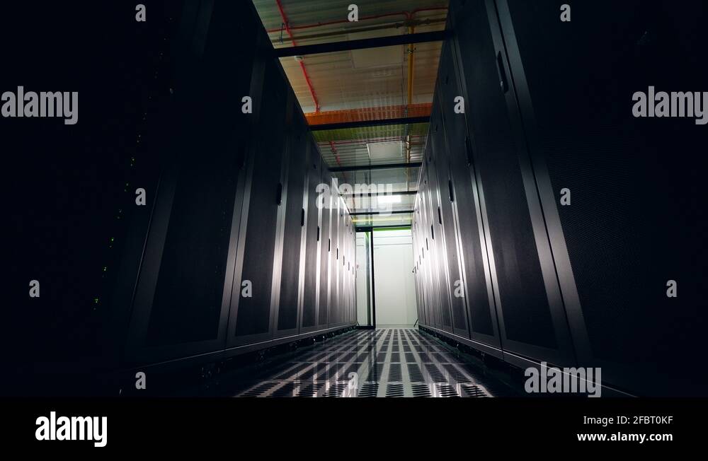 Datacenter server room concept. Dark room with server units and a ...