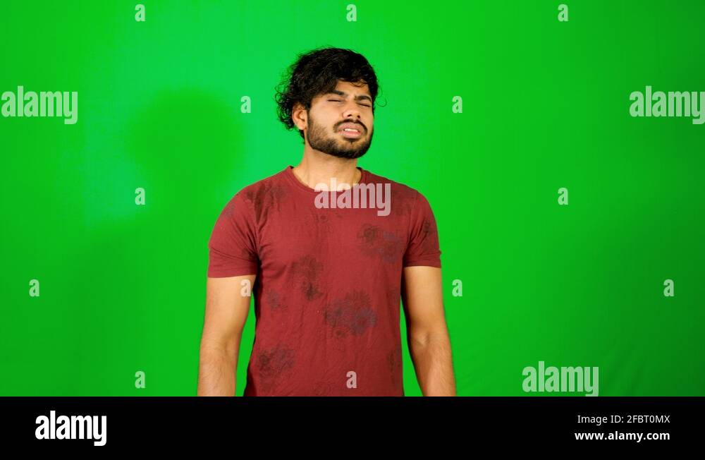 Indian man shy with green background Indian green screen Stock Video ...