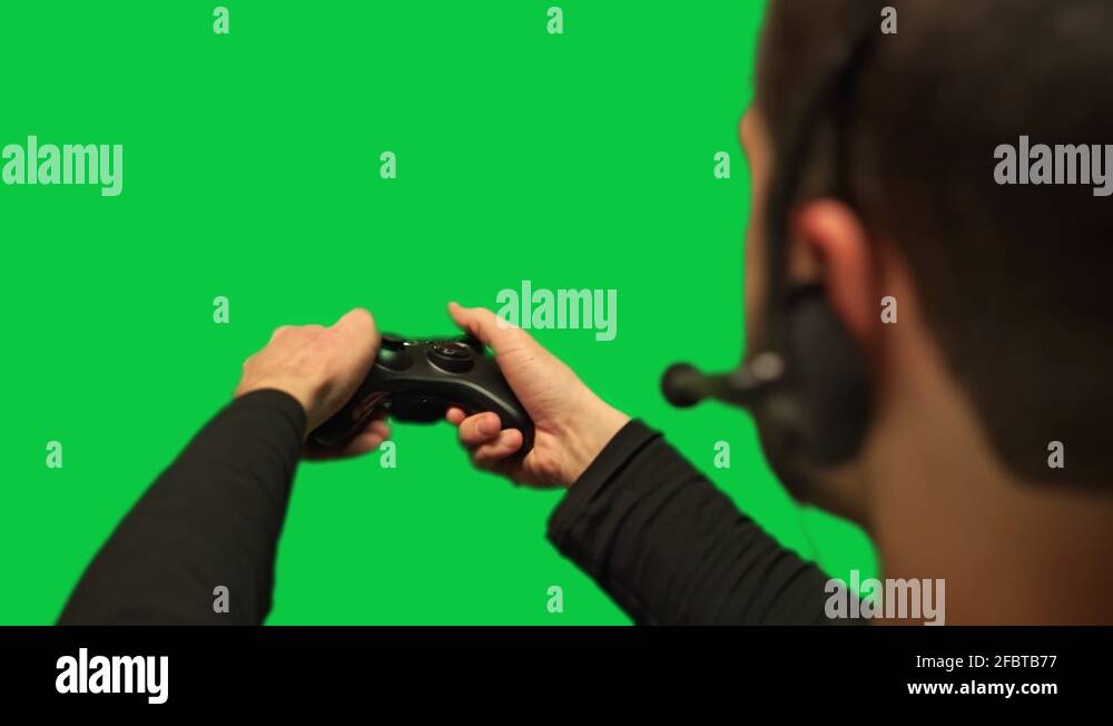 Man play with game controller on green screen, back view Stock Video ...