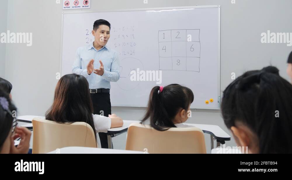 Teacher introduce new student at classroom. Education concept Stock ...