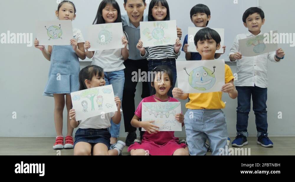 Student showing drawing cartoon with teacher Stock Video Footage - Alamy