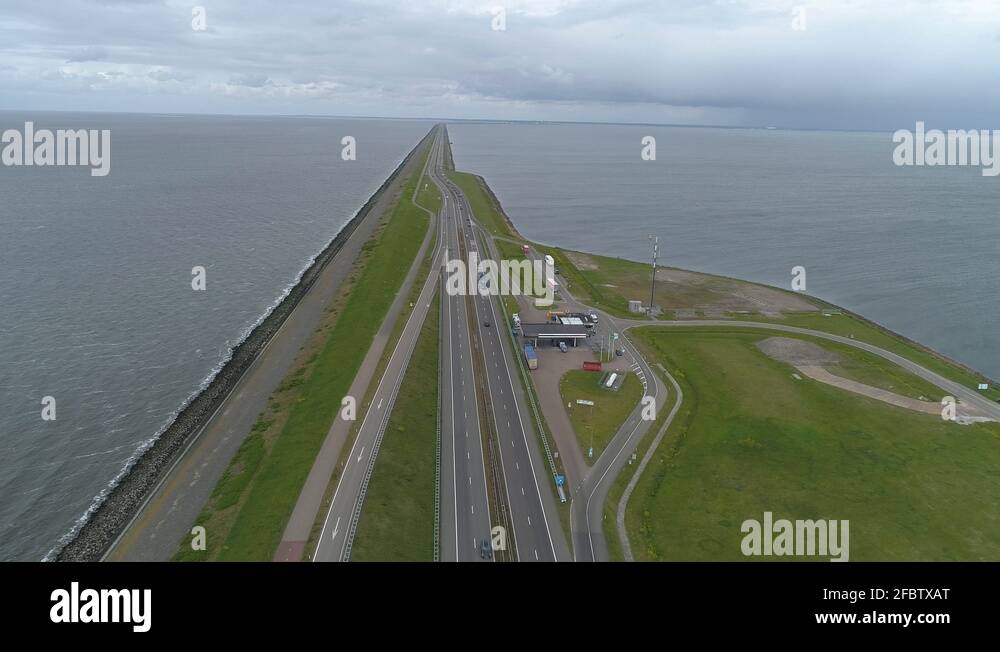 ARIAL SLIDE shot of the ARIAL LIFT shot of the De Afsluitdijk dam and Stock Video Footage - Alamy
