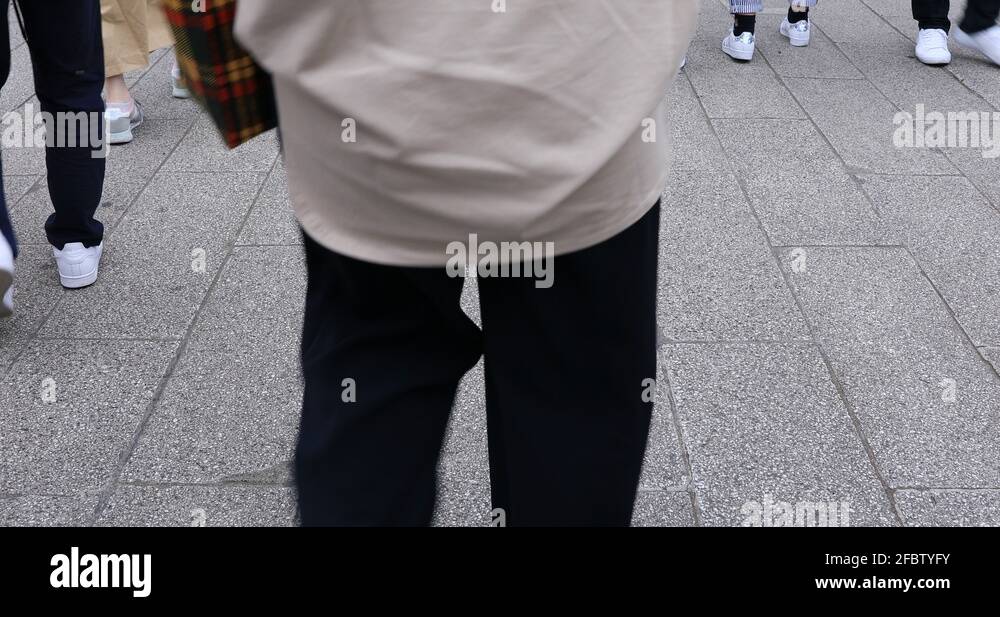 Body parts of walking people at the stone paved road in Asakusa Stock ...