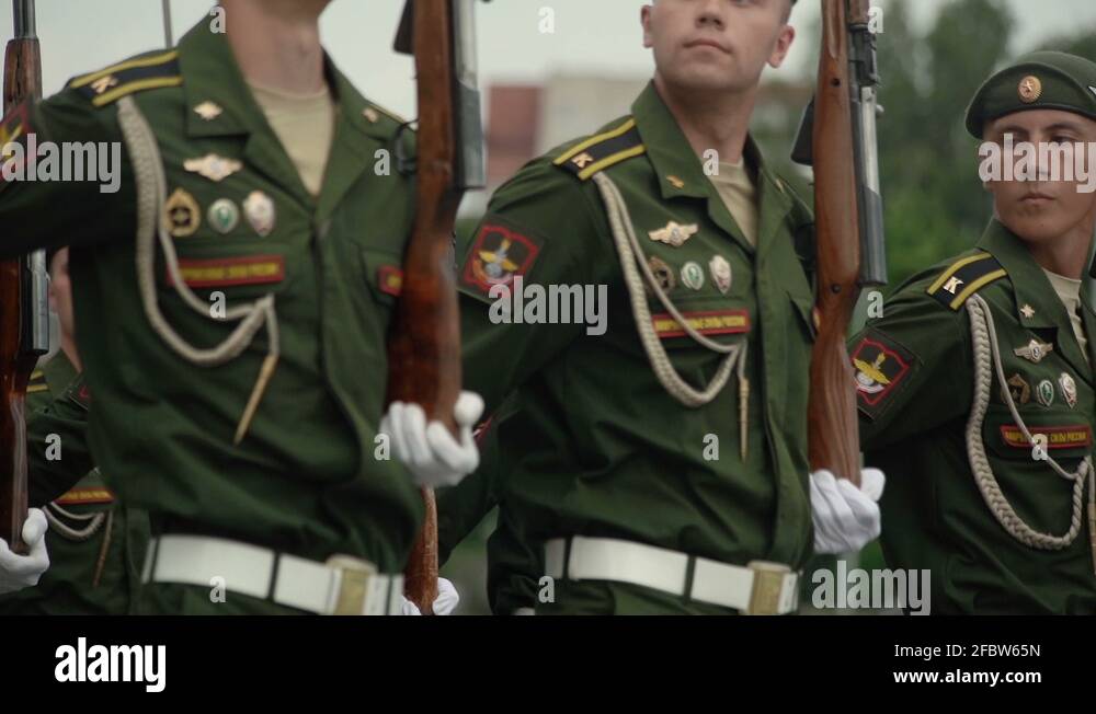 Infantry soldiers marching in the parade carrying weapons in their ...