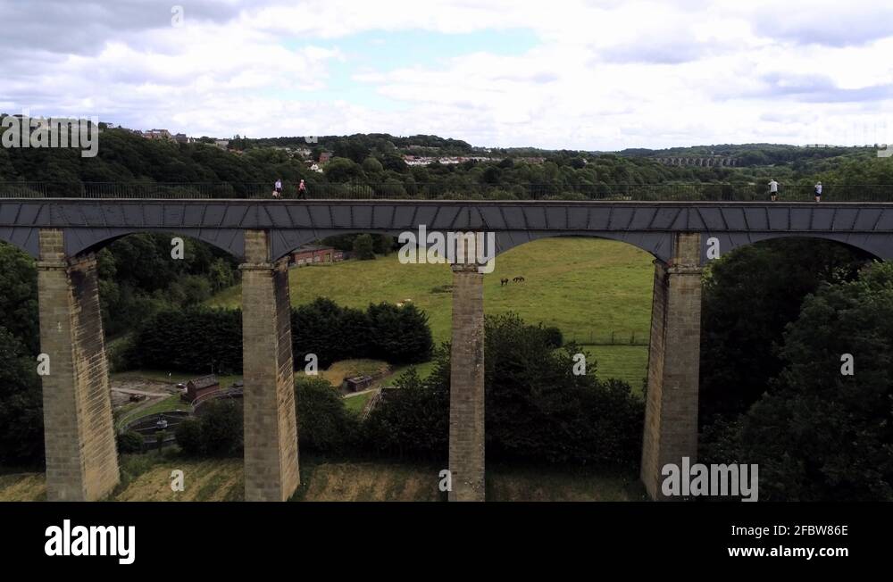 Pontcysyllte Aqueduct arch bridge canal waterway crossing. Aerial tilt ...