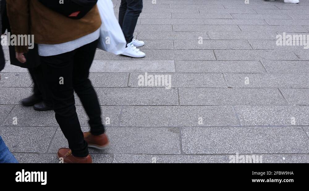 Body parts of walking people at the stone paved road in Asakusa Stock ...