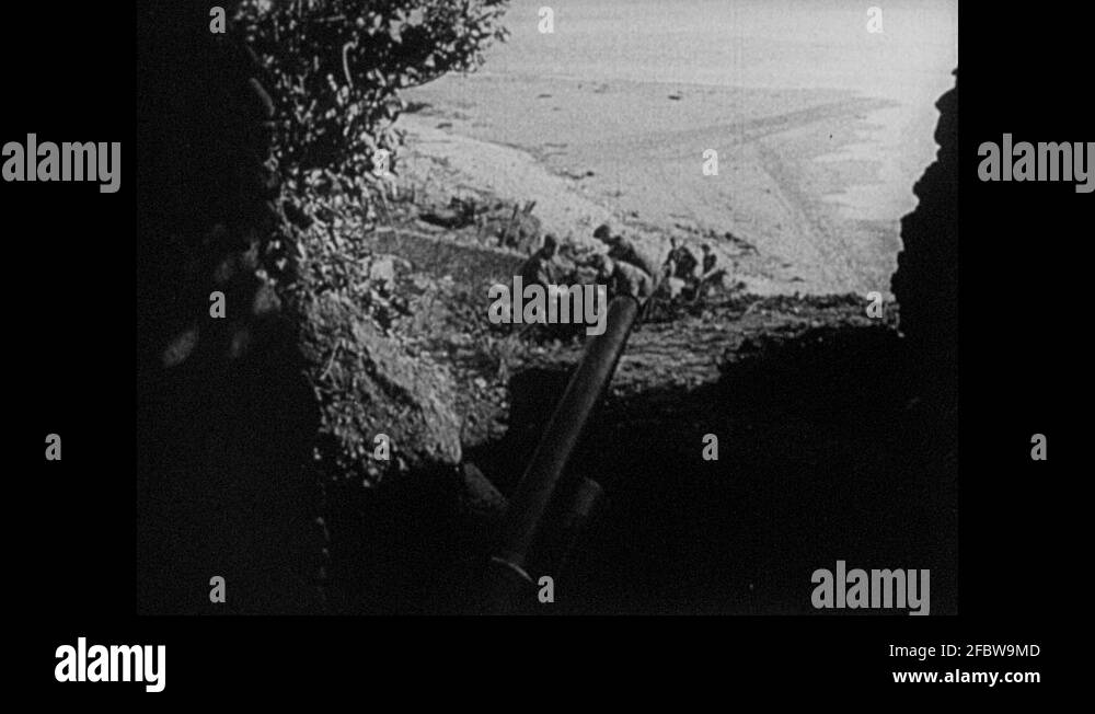 1940s: Beachside cave with cannon and Nazi soldiers. Two soldiers in ...