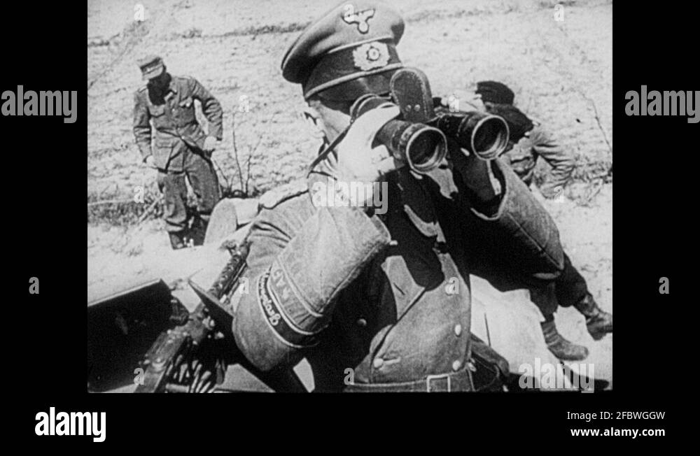 1940s: Nazi officer with binoculars. Soldier smokes a cigarette. Boats ...
