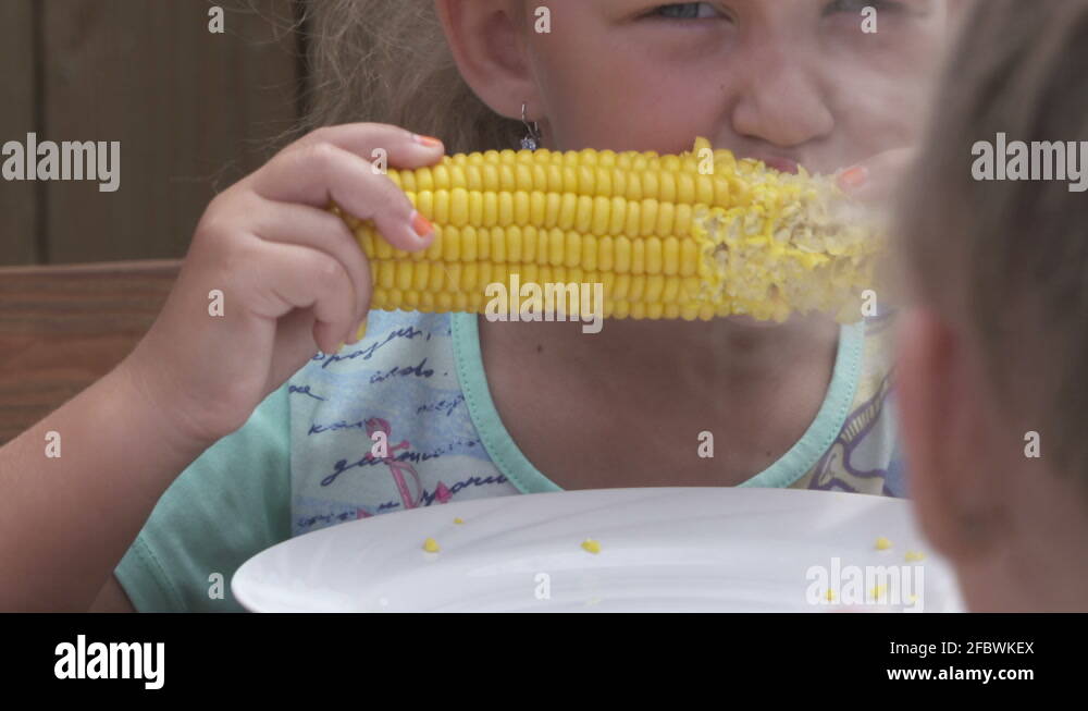 Little girl eating sweet corn Stock Videos & Footage - HD and 4K Video ...