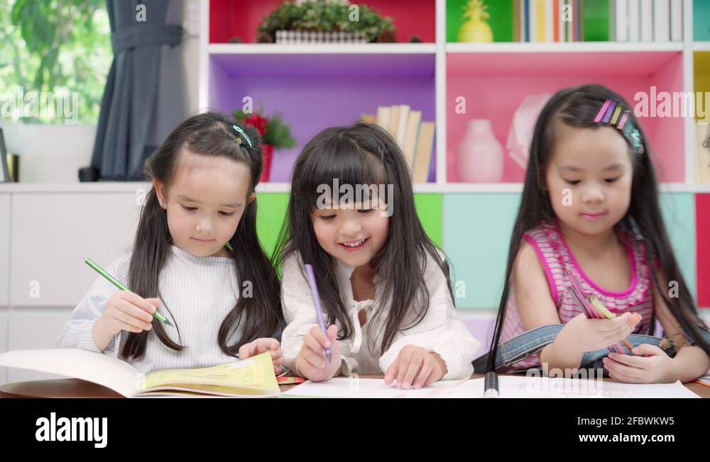 Group of children drawing in classroom Stock Video Footage - Alamy