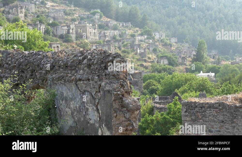 Zoom out houses of ghost town in summer haze Stock Video Footage - Alamy