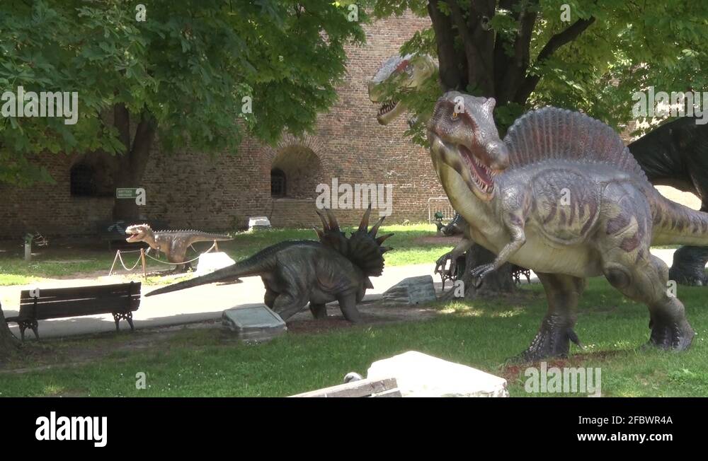 Realistic dinosaurs in dino park Around the bench for sitting Stock ...