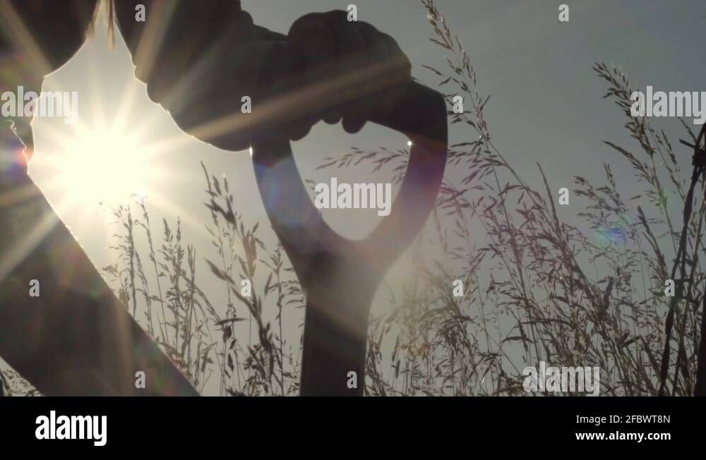 Farmer digging in hay field with fork in sunshine Stock Video Footage ...
