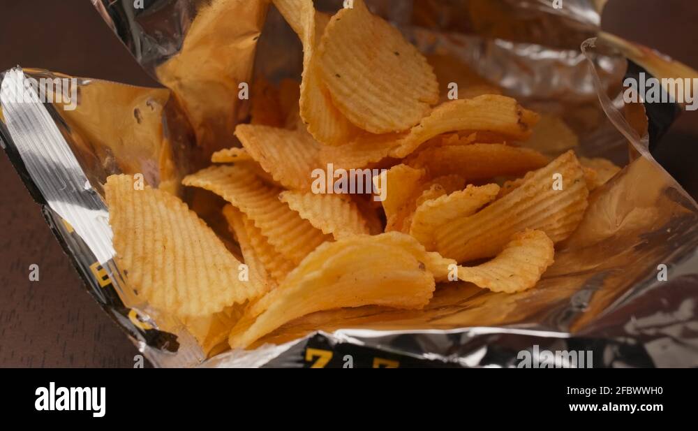 Eat crisps packet Stock Videos & Footage - HD and 4K Video Clips - Alamy