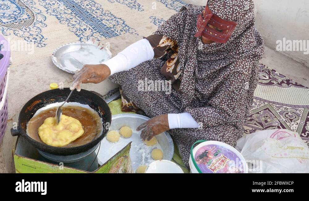Muslim woman with islamic hijab burqa covering her face baking ...