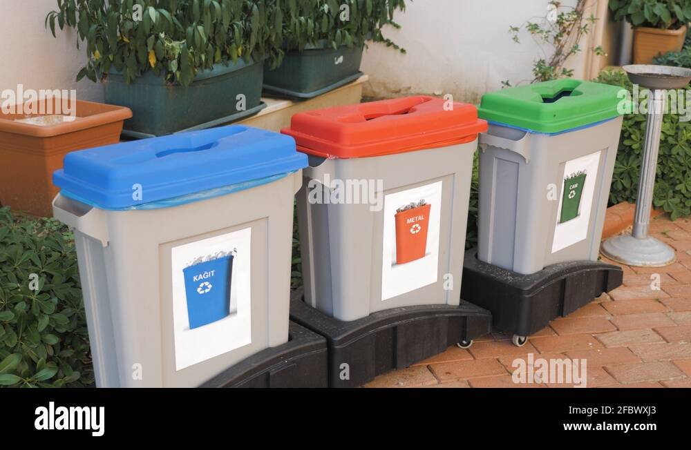Three different colorful trash bins or containers. Garbage sorting and ...