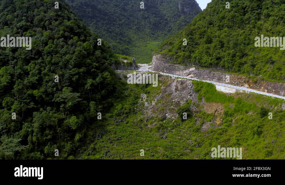 Flying towards gap in mountain ridge at Ma Pi Leng Pass. Mountain pass ...