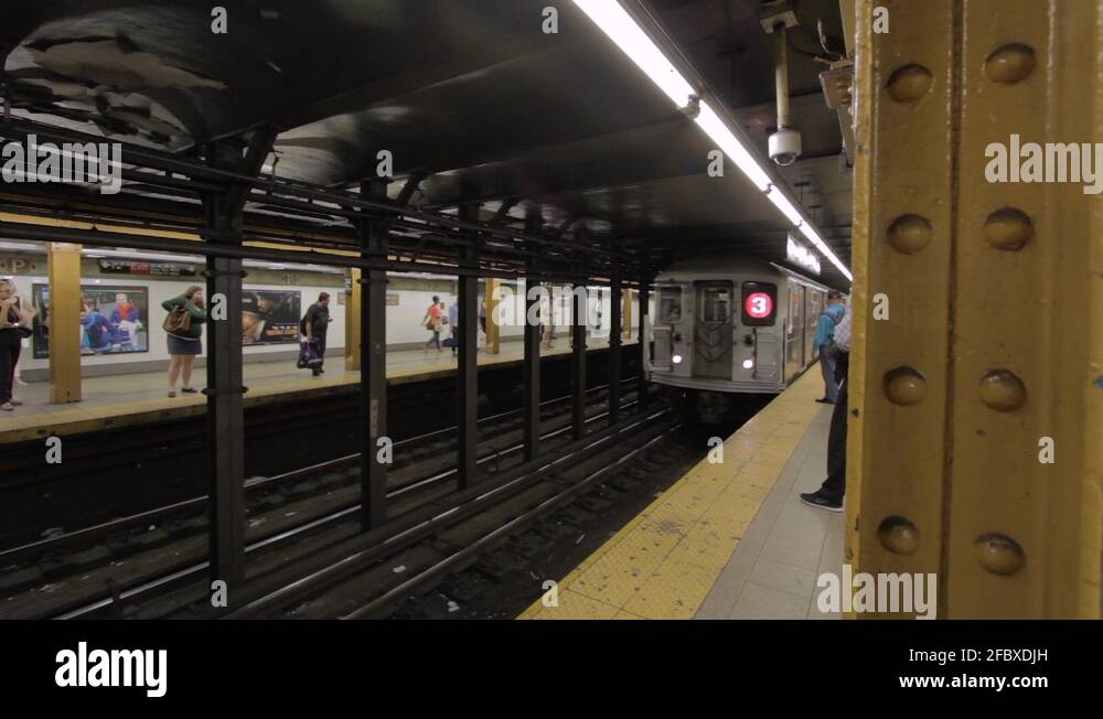 People Enter And Exit A Subway Train In New York City, From Platform ...