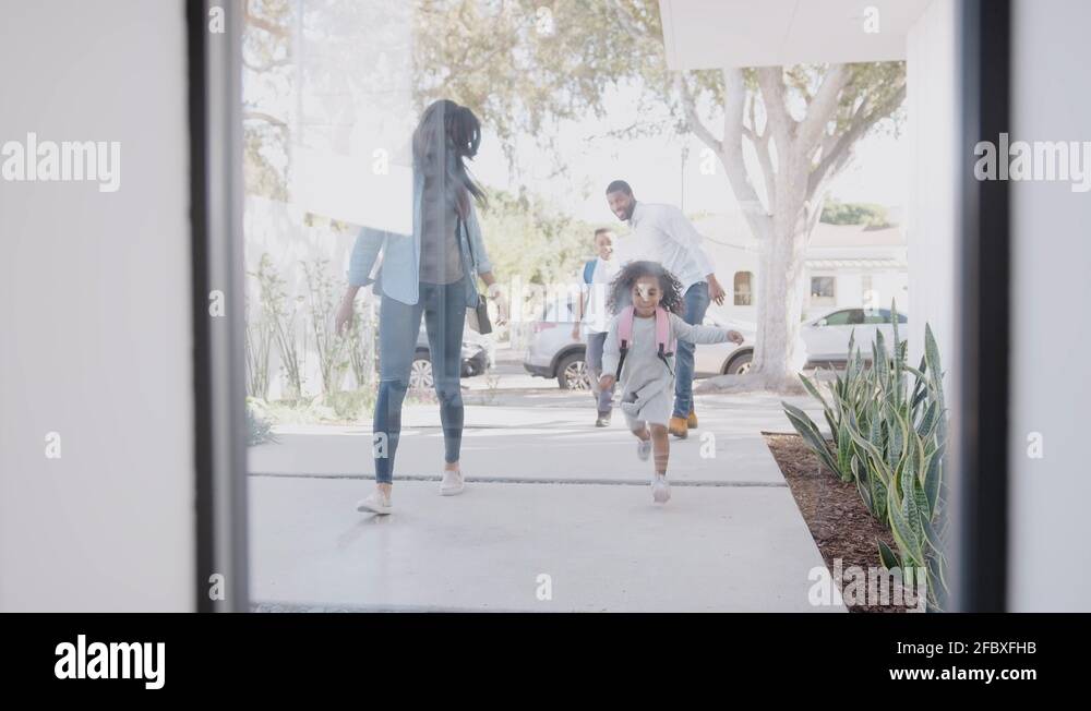 Parents Bringing Excited Children Back Home From School Opens Front ...