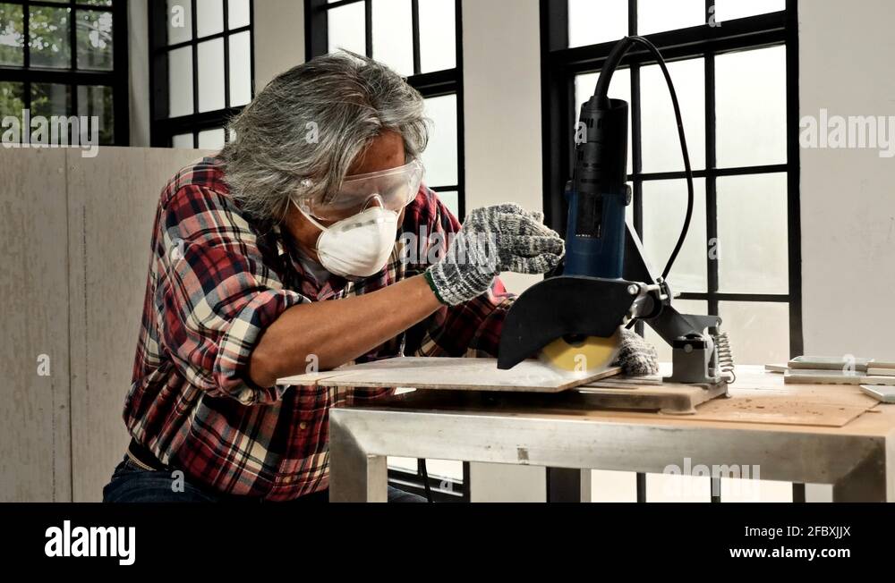 Retired asian men are learning construction workers. Practicing using ...