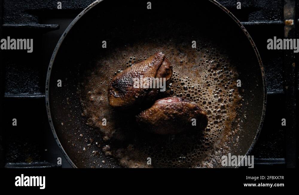 Professional chef cooking flame grilled chicken fillets in 4K slow ...