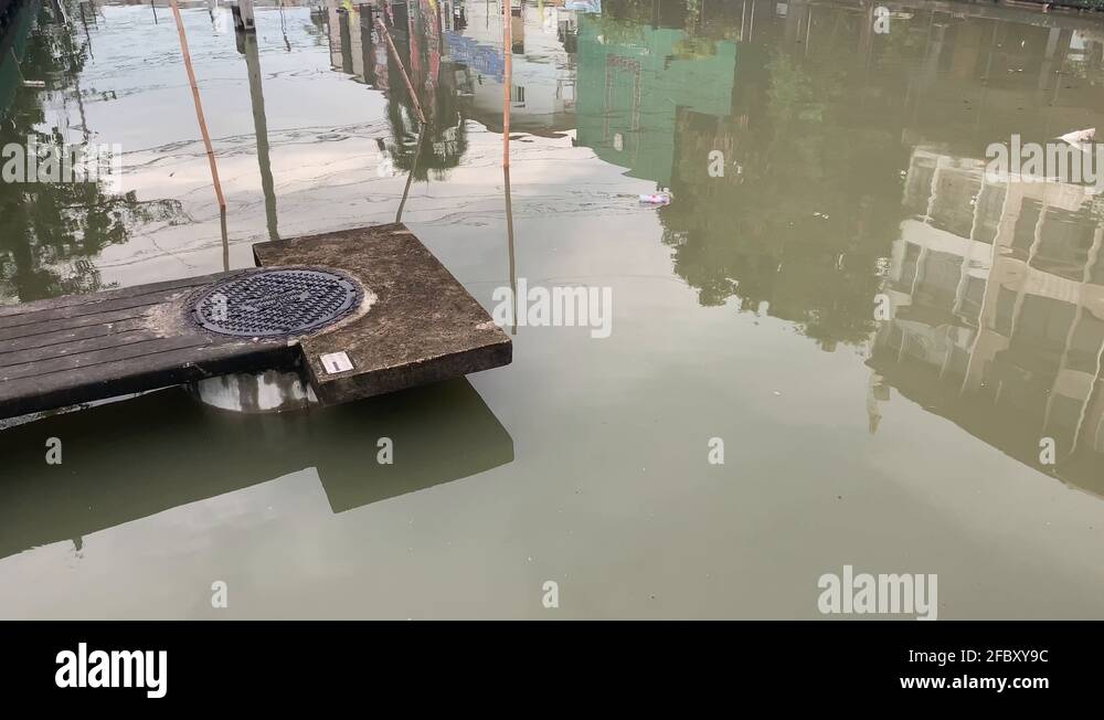 Overflow sewage drain almost flooded with high water level Stock Video ...