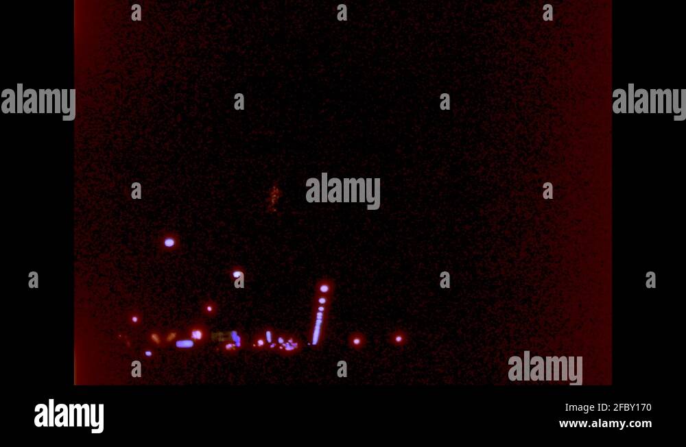 1960s: Fireworks explode in night sky over street lights Stock Video ...