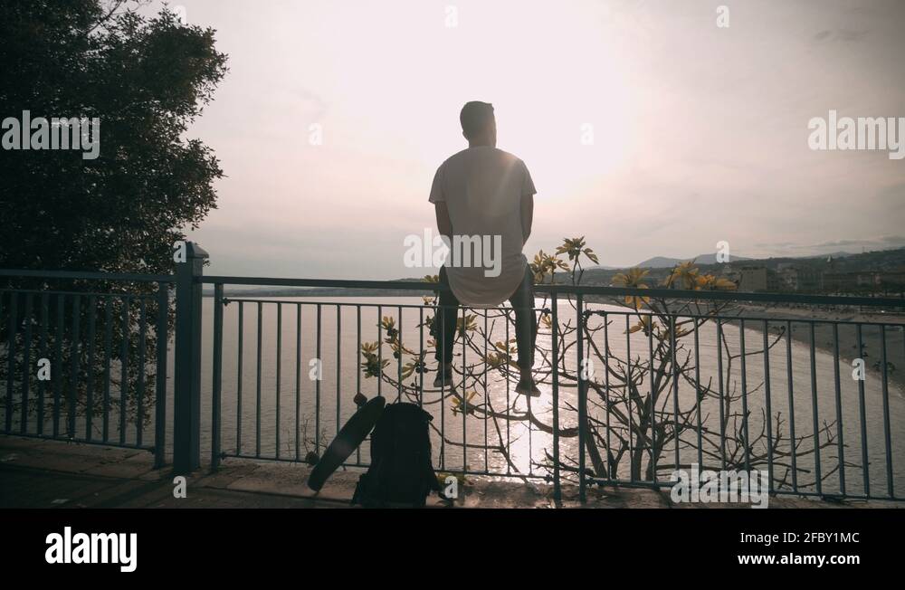 Man sitting on fence Stock Videos & Footage - HD and 4K Video Clips - Alamy