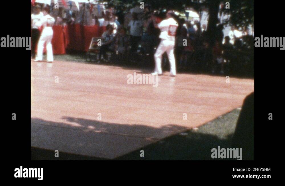 1960s: People dance on outdoor dance floor, wave cloth in air Stock ...