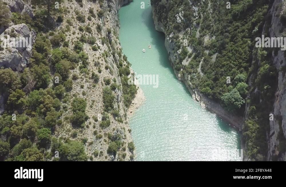 Breathtaking aerial tilt view of Verdon river to valley and high canyon ...