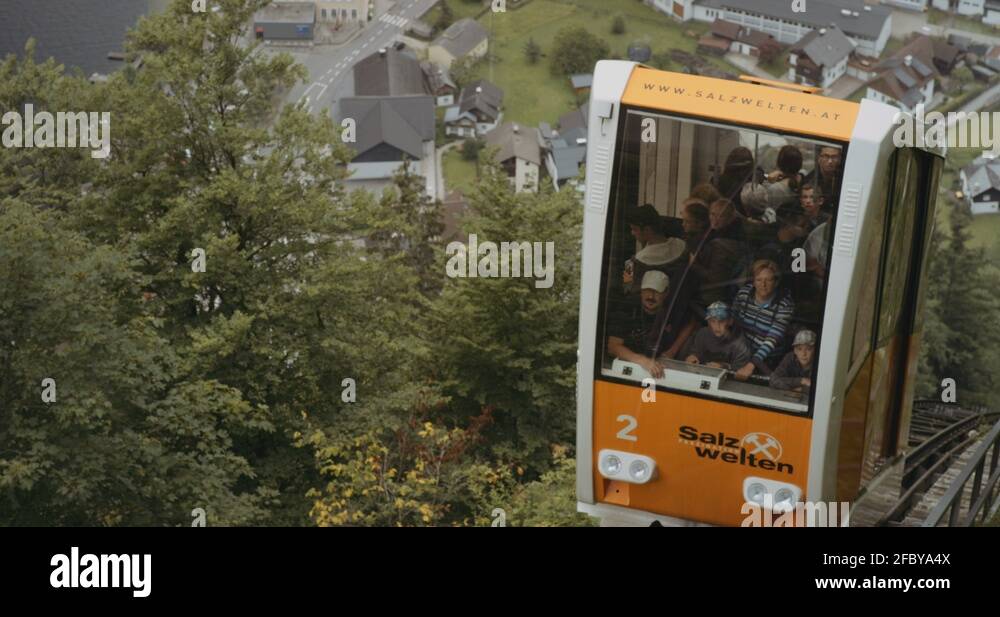 Tourists inside the funicular railway from Hallstatt to the World ...