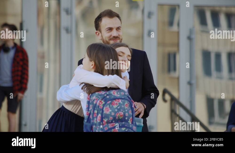 Happy parents hugging daughter outdoors Stock Videos & Footage - HD and ...