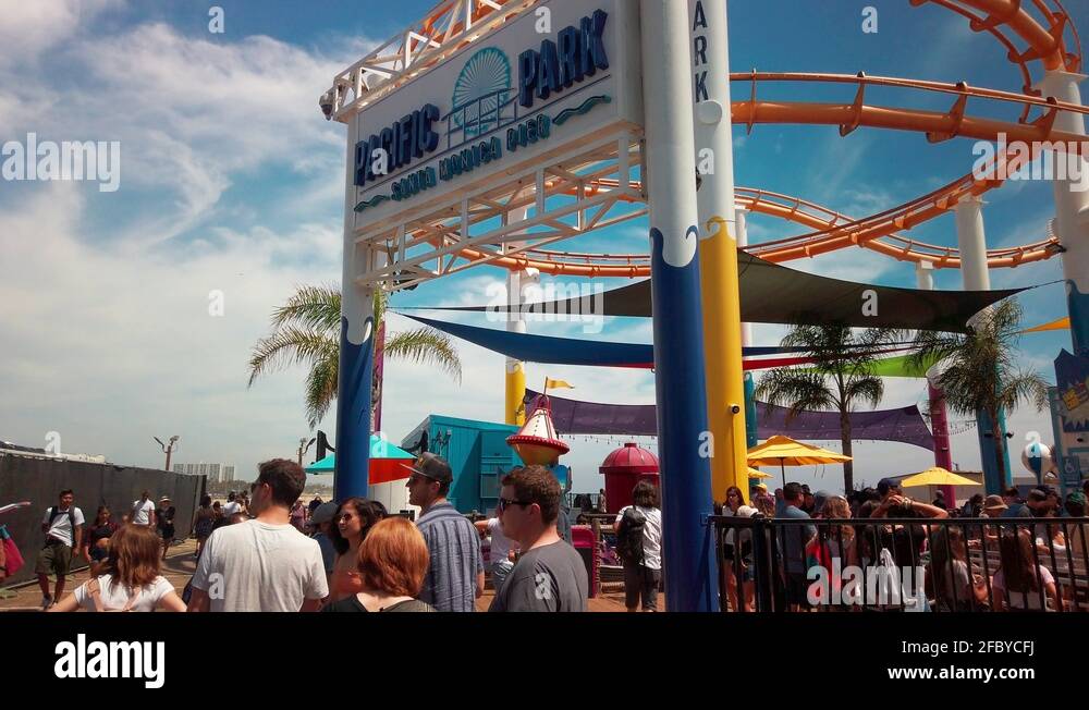 Pacific Park amusement park entrance with rollercoaster going by in the ...