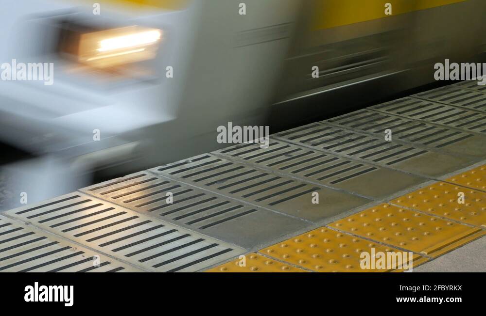 Ant's eye lower view of the train platform level while the train ...