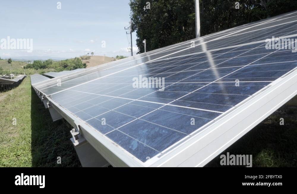close up dolly pull in of a solar panel installed in a solar plant ...